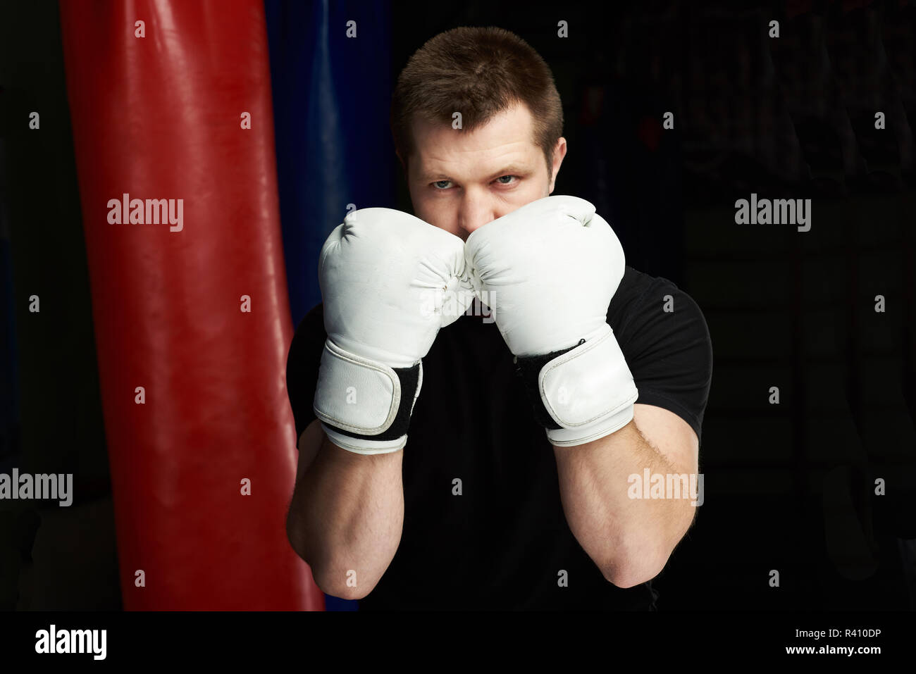 Boxer man in defense pose in white gloves. Protection theme Stock Photo ...