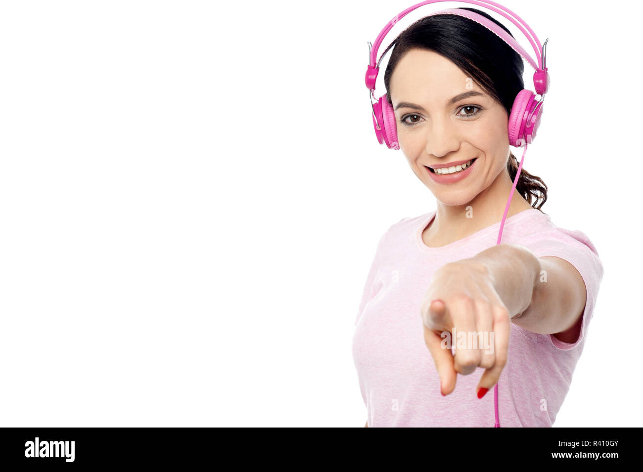 Smiling woman enjoying music Cut Out Stock Images & Pictures - Alamy