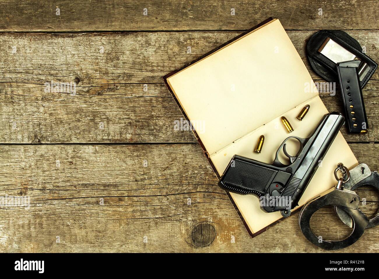 Police desk. Books of laws and police handcuffs. Investigation of crime ...