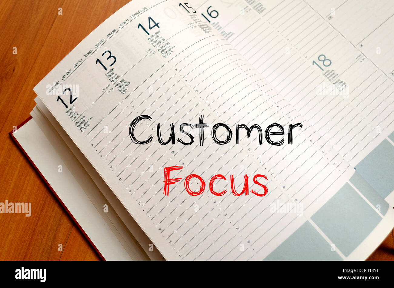 Customer focus write on notebook Stock Photo - Alamy