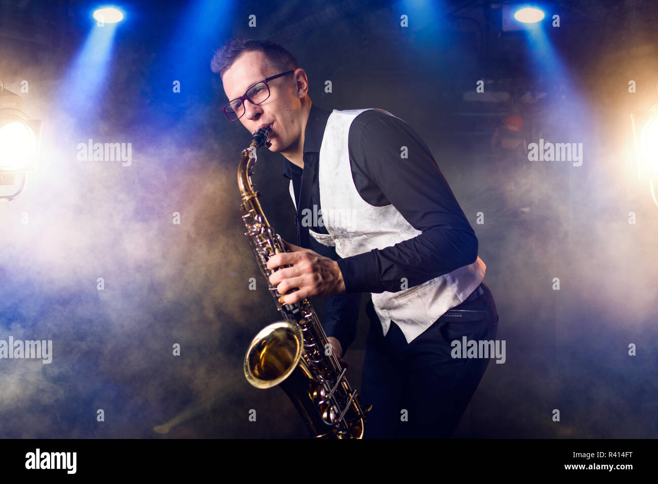 Male saxophonist playing classical music on sax. Saxophone melody ...