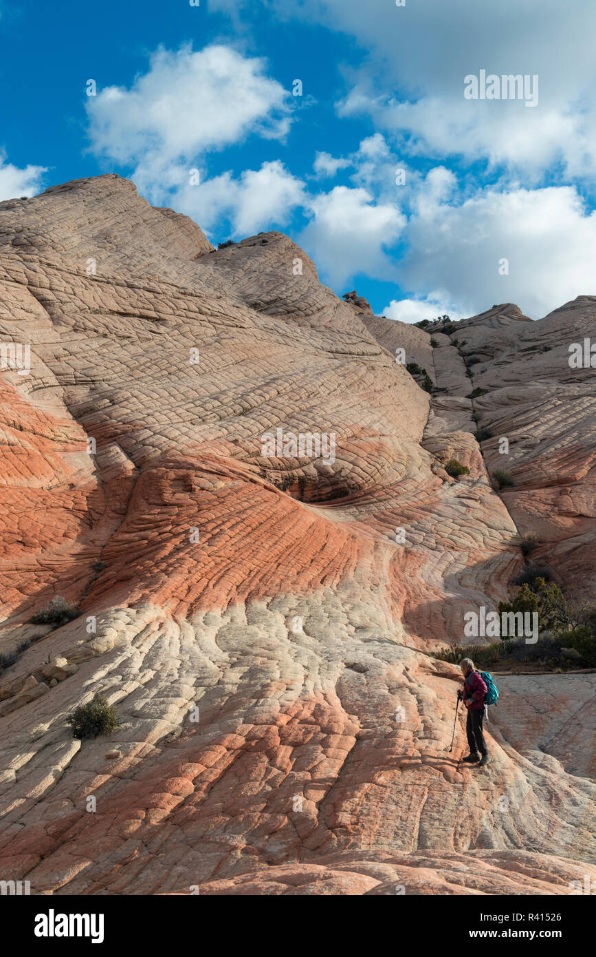 Hiker in Sandstone Rock Candy Cliffs area, near St. George, Utah (MR ...