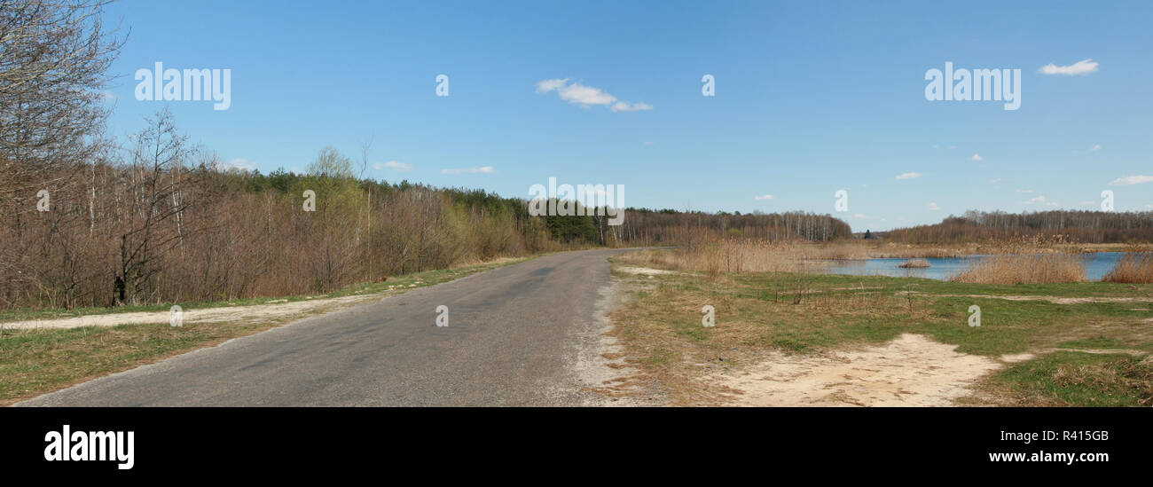 Rural (road, lake, forest) landscape, cloudscape, rich blue colour ...