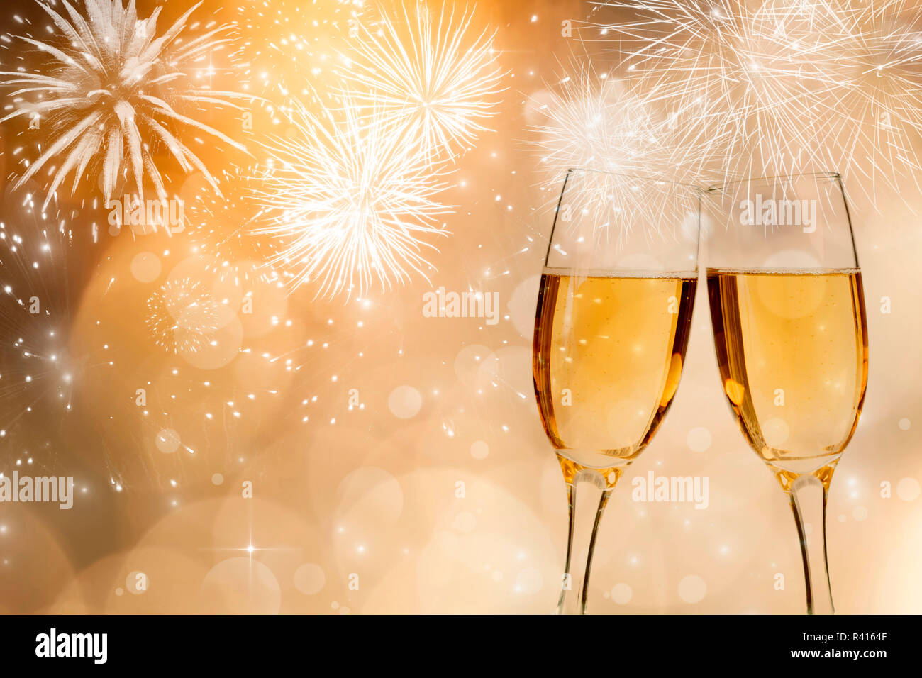 Champagne over fireworks and sparkling holiday lights Stock Photo - Alamy