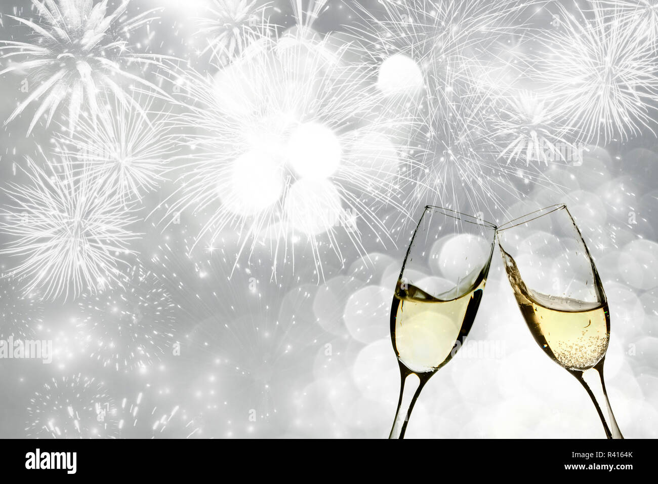 Champagne over fireworks and sparkling holiday lights Stock Photo - Alamy