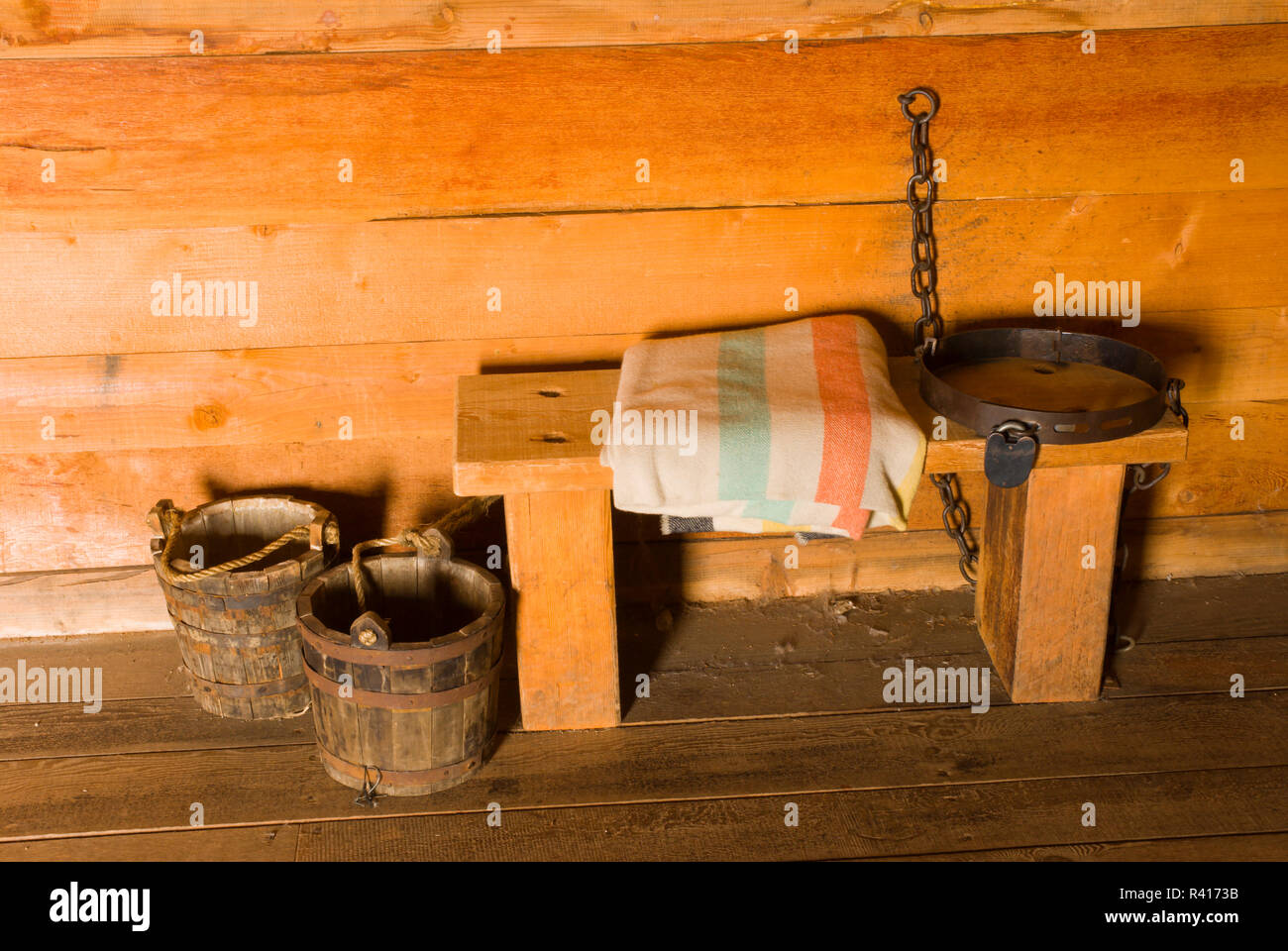 Bench, buckets, and shackle in the jail, Fort Vancouver National ...