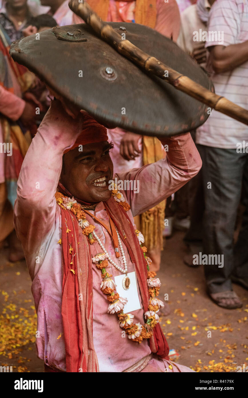Indian women beating man stick hi-res stock photography and images - Alamy