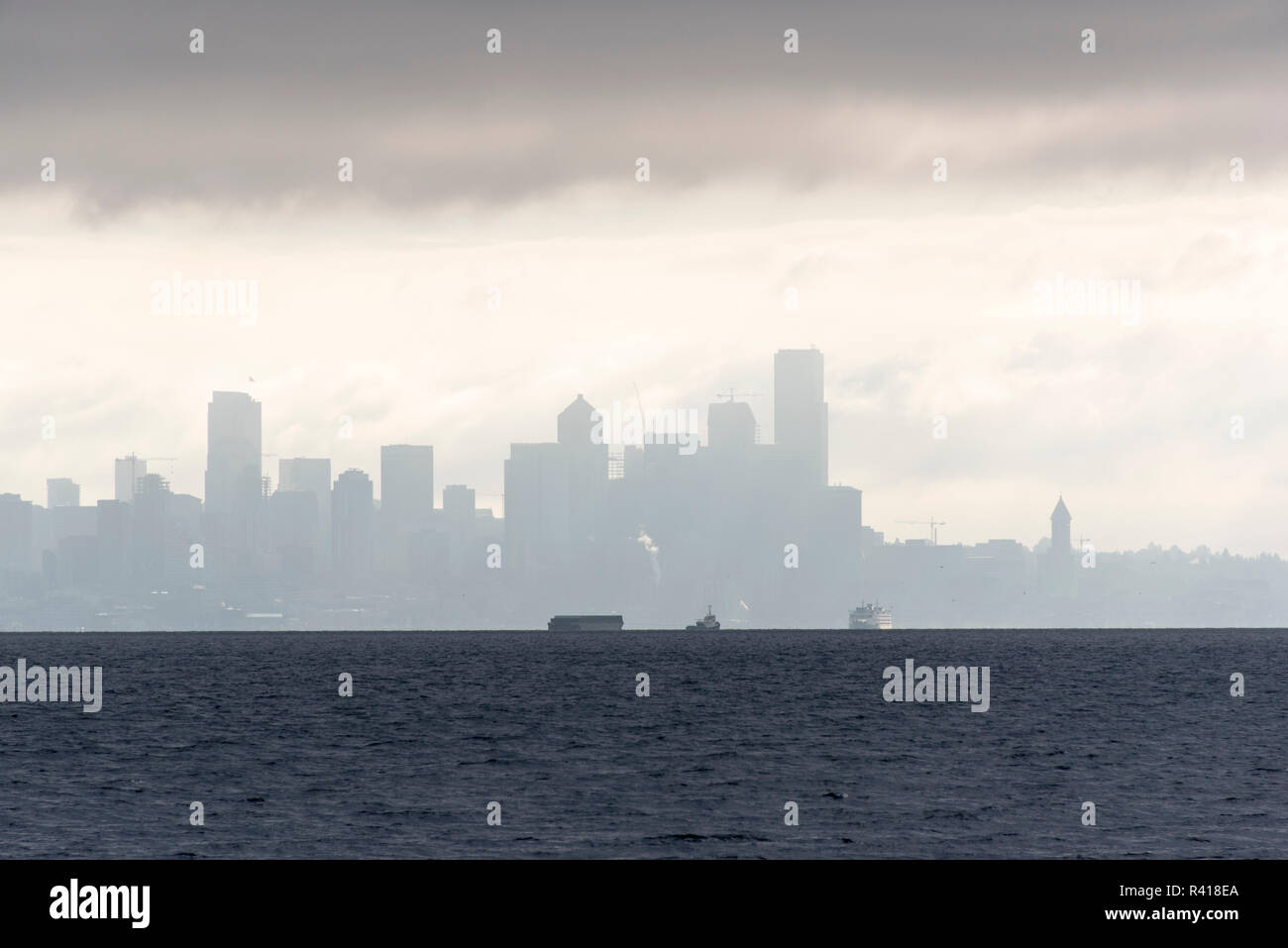 USA, Washington State, Puget Sound. Seattle skyline silhouette gray day ...