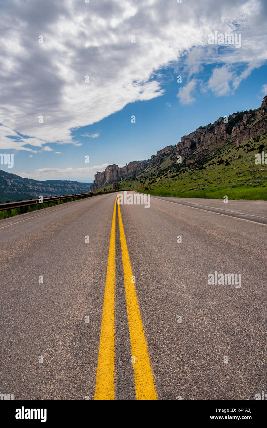 Middle of Road Winding Through Mountains with guardrail Stock Photo - Alamy