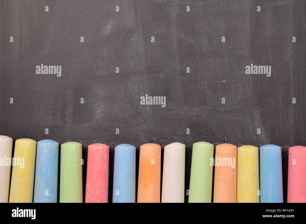 Colorful chalk on blackboard Stock Photo - Alamy