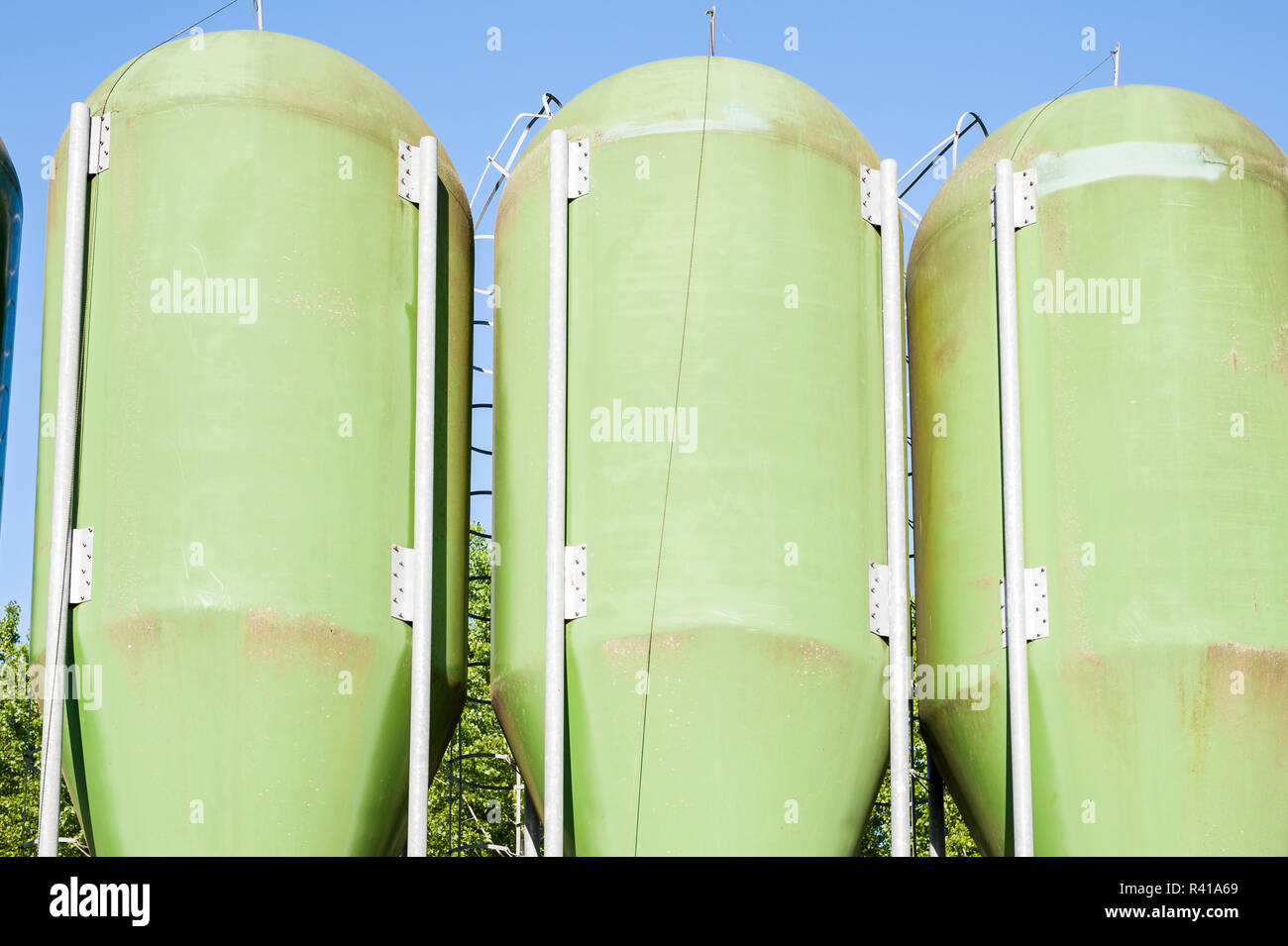 Agricultural green silos Stock Photo - Alamy