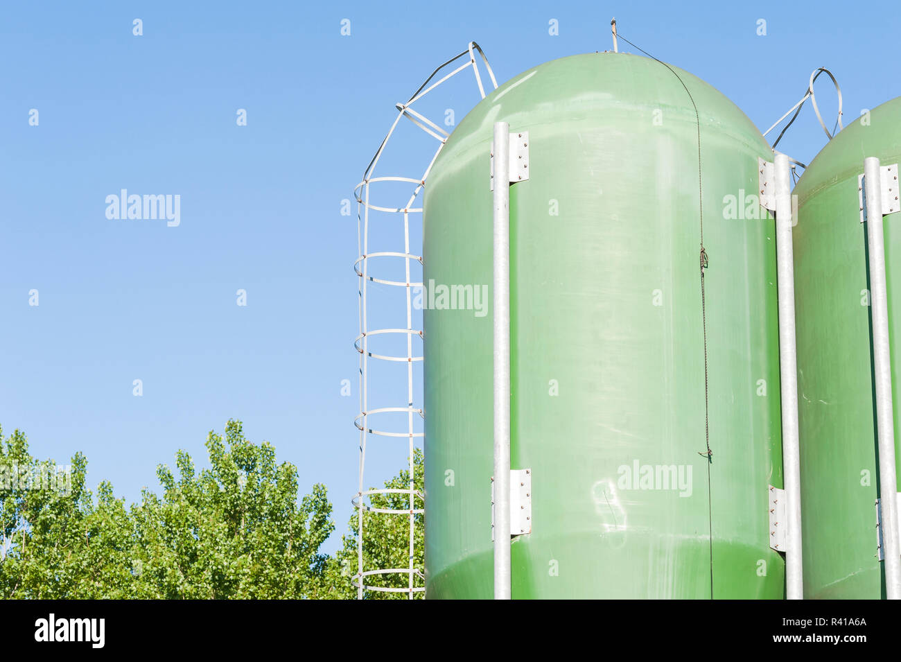 Agricultural green silos Stock Photo - Alamy