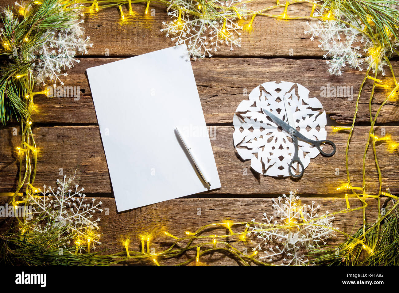 The blank sheet of paper on the wooden table with a pen Stock Photo - Alamy