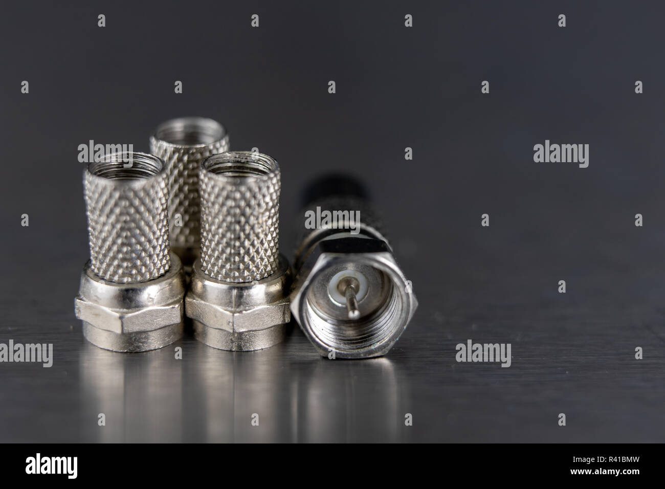 Antenna and television connectors on a metal table. Accessories for ...