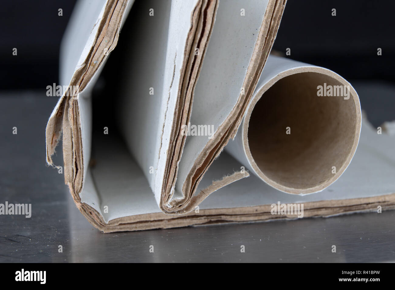 Waste paper bound with a gray cord. Old papers and cardboard intended ...