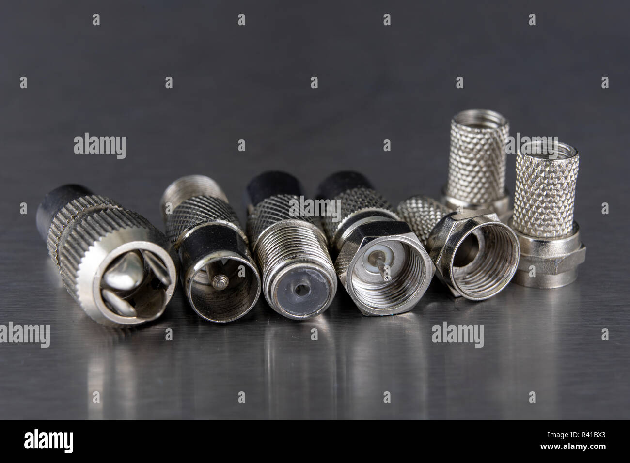 Antenna and television connectors on a metal table. Accessories for ...