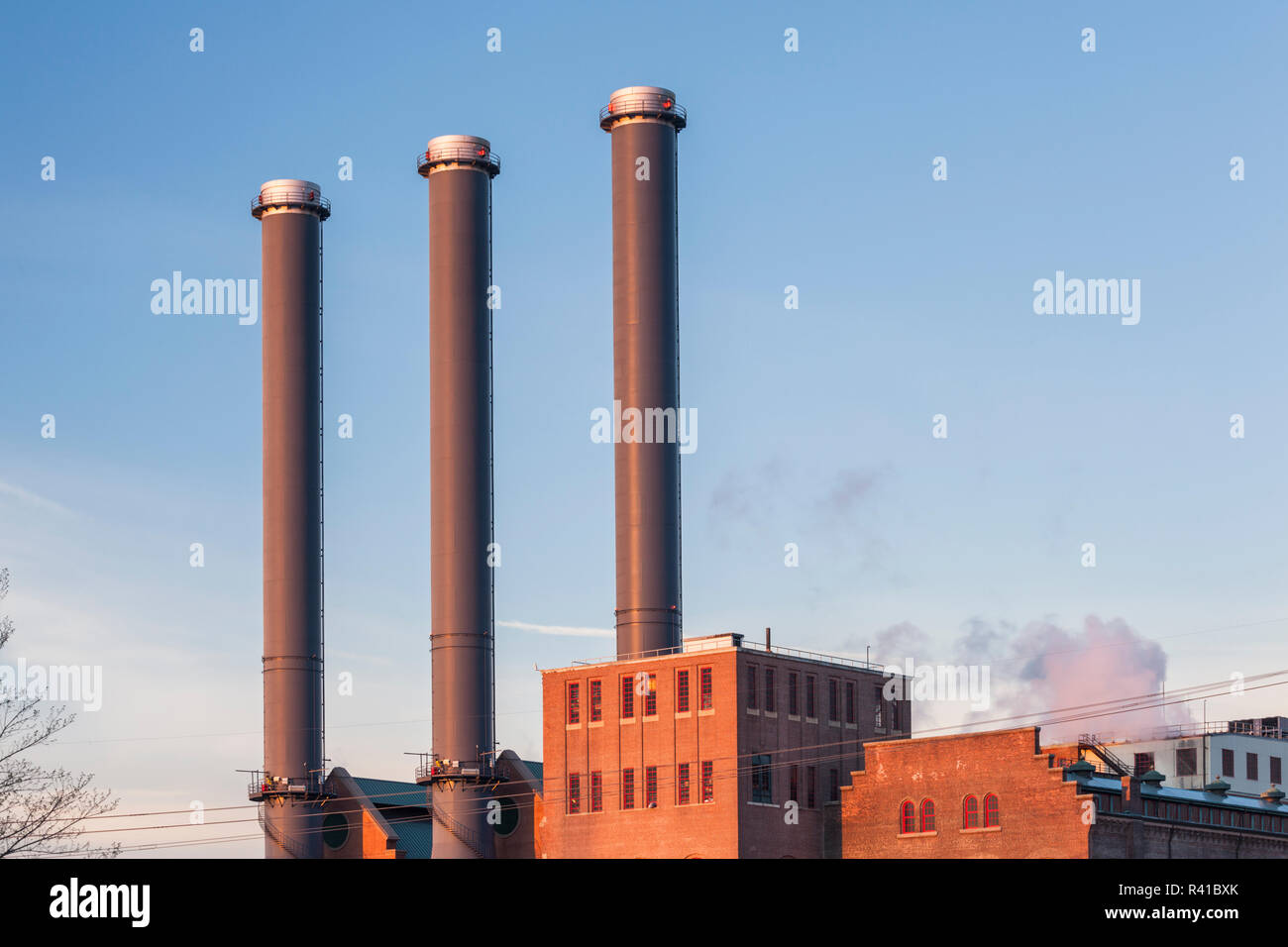 USA, Rhode Island, Providence, power plant smokestacks at dawn Stock ...