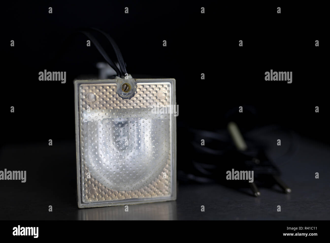 Old flash lamps on a metal table. Photo accessories from central europe ...