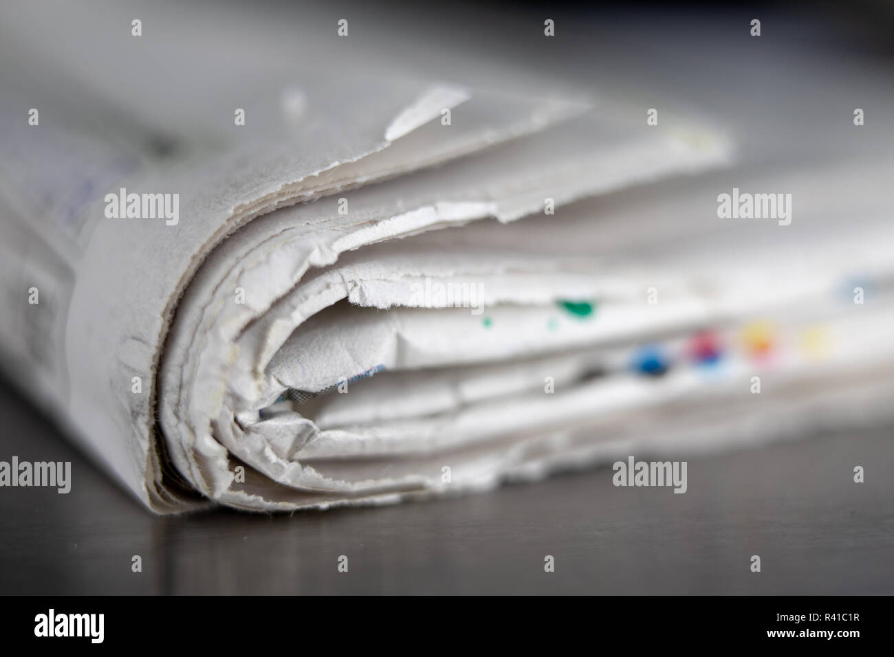 Waste paper bound with a gray cord. Old papers and cardboard intended ...