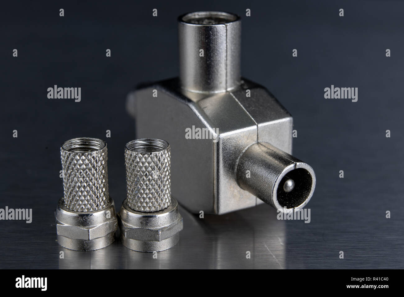 Antenna and television connectors on a metal table. Accessories for ...