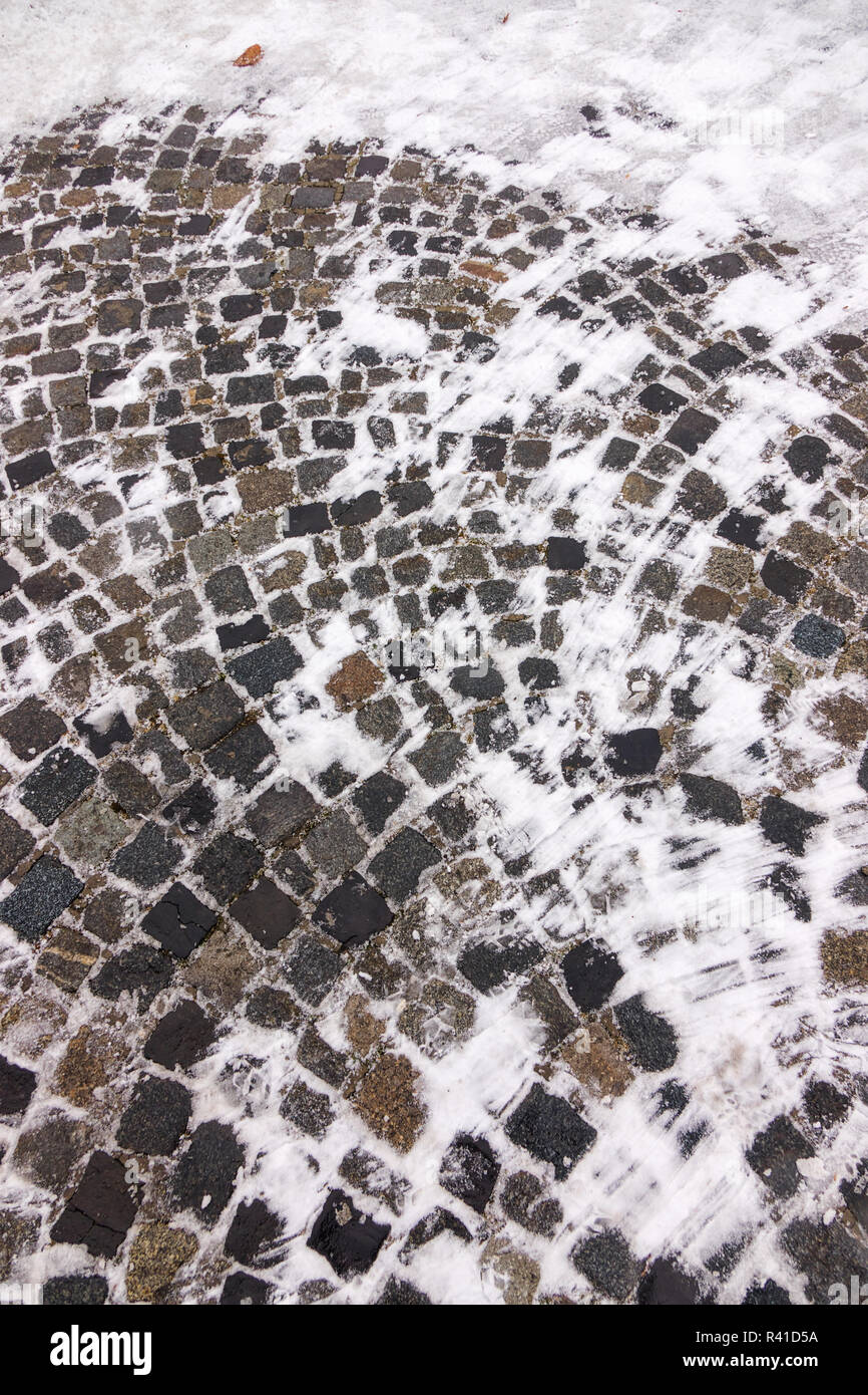 Cobble under the snow Stock Photo - Alamy