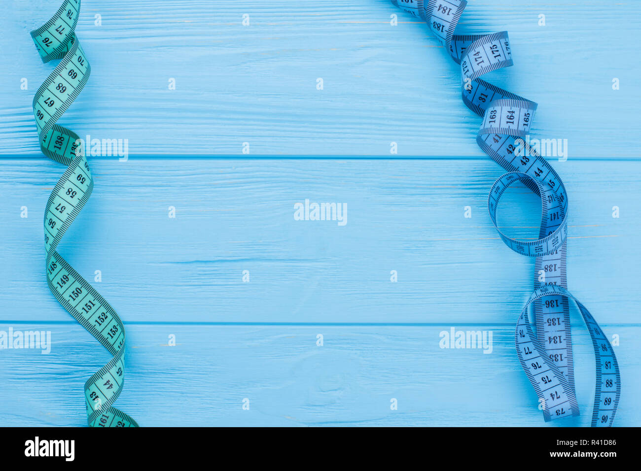 Frame from measuring tapes with copy space. Two tailor measuring tapes ...