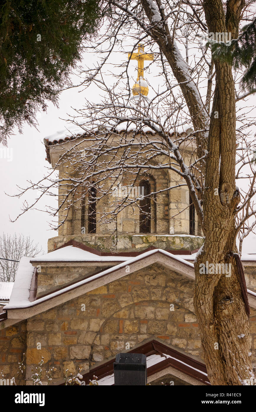 Orthodox Church in the city underthe snow Stock Photo - Alamy