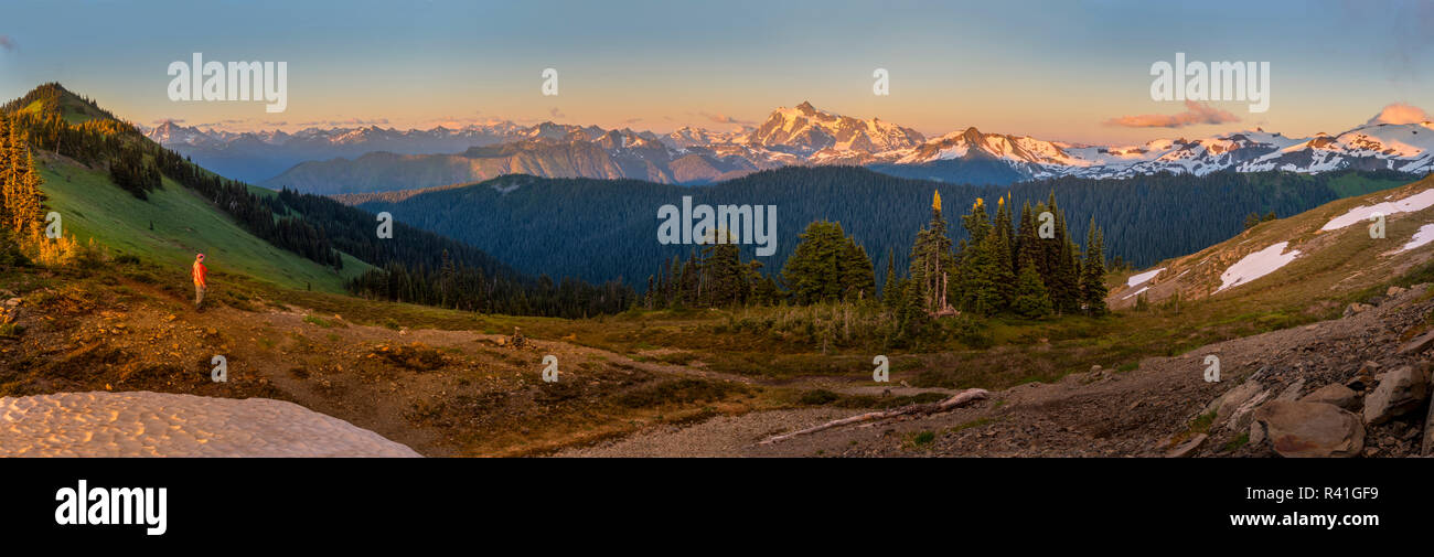 USA, Washington State. Panorama with man at Skyline Divide near Mt ...