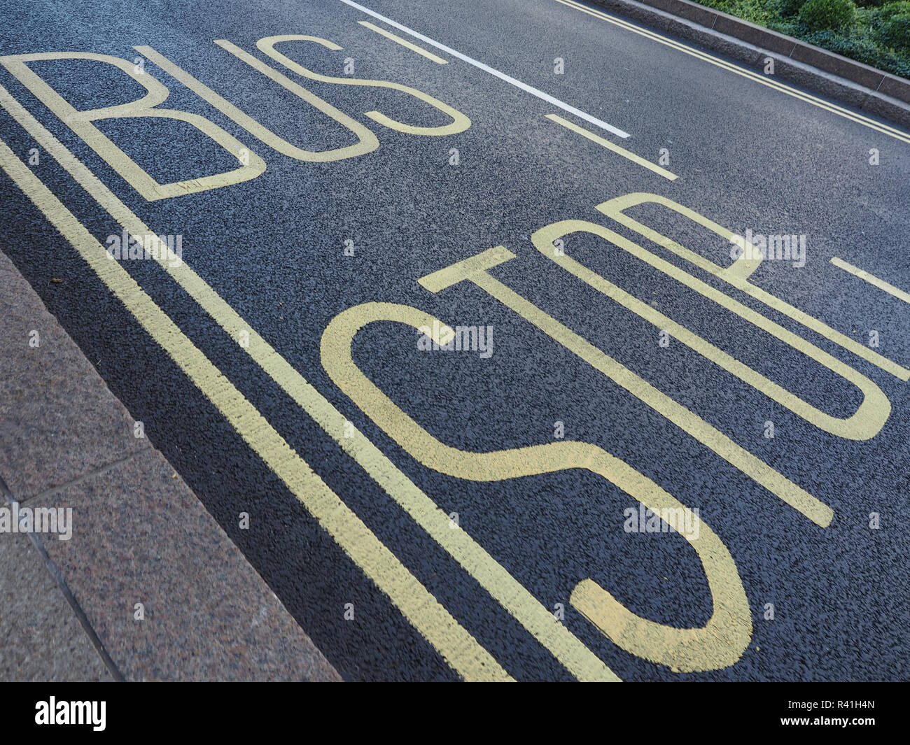 Bus stop sign Stock Photo - Alamy