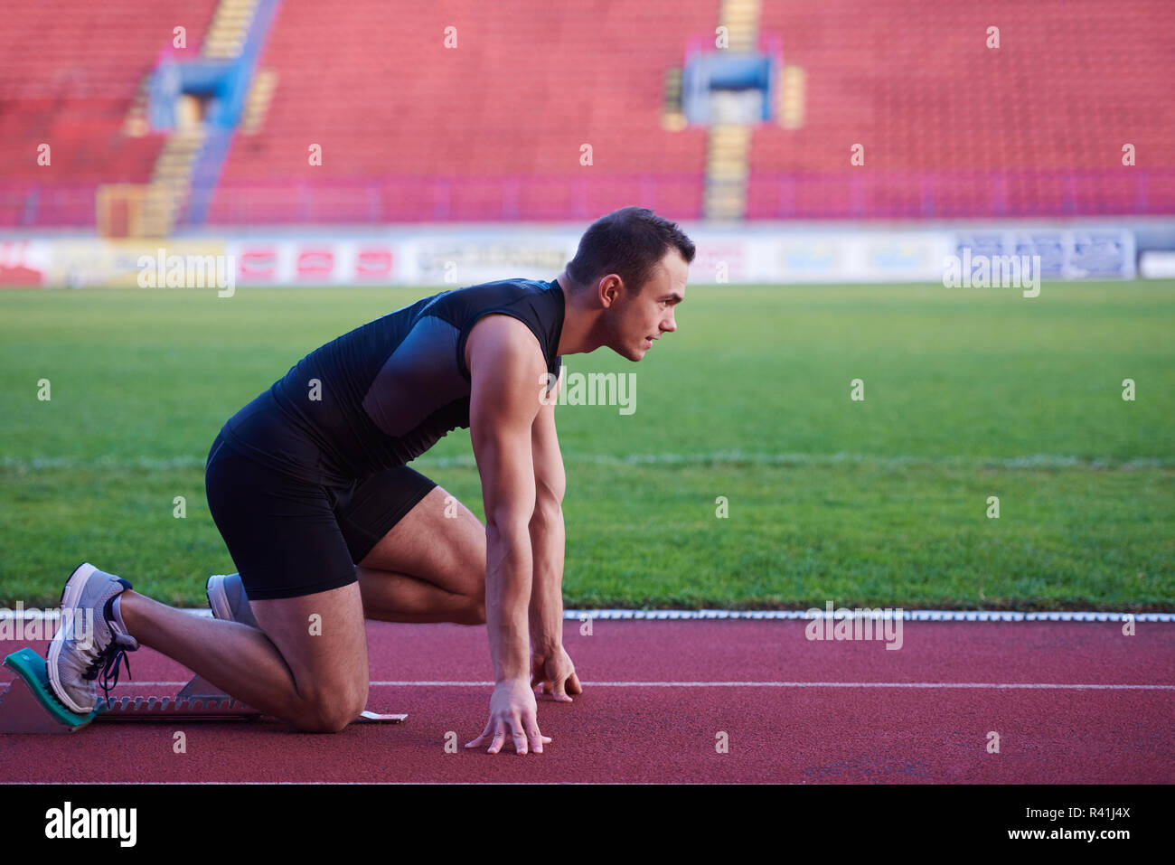 Athletic man start Stock Photo - Alamy