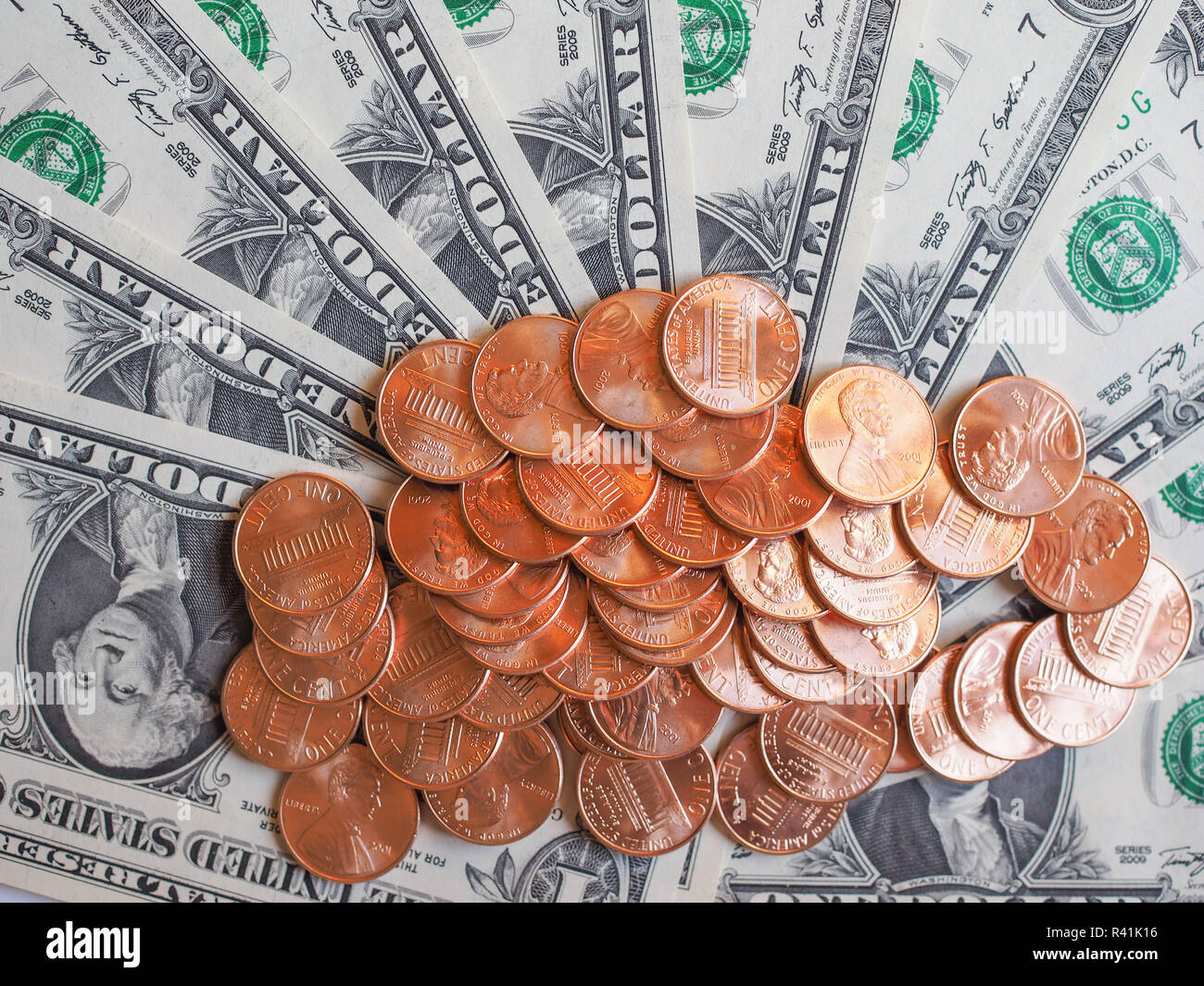 Dollar coins and notes Stock Photo - Alamy