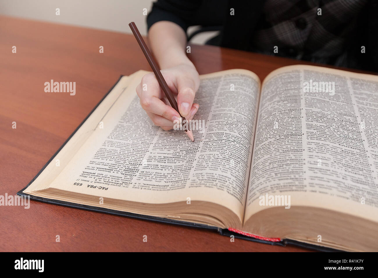 student studying book Stock Photo - Alamy