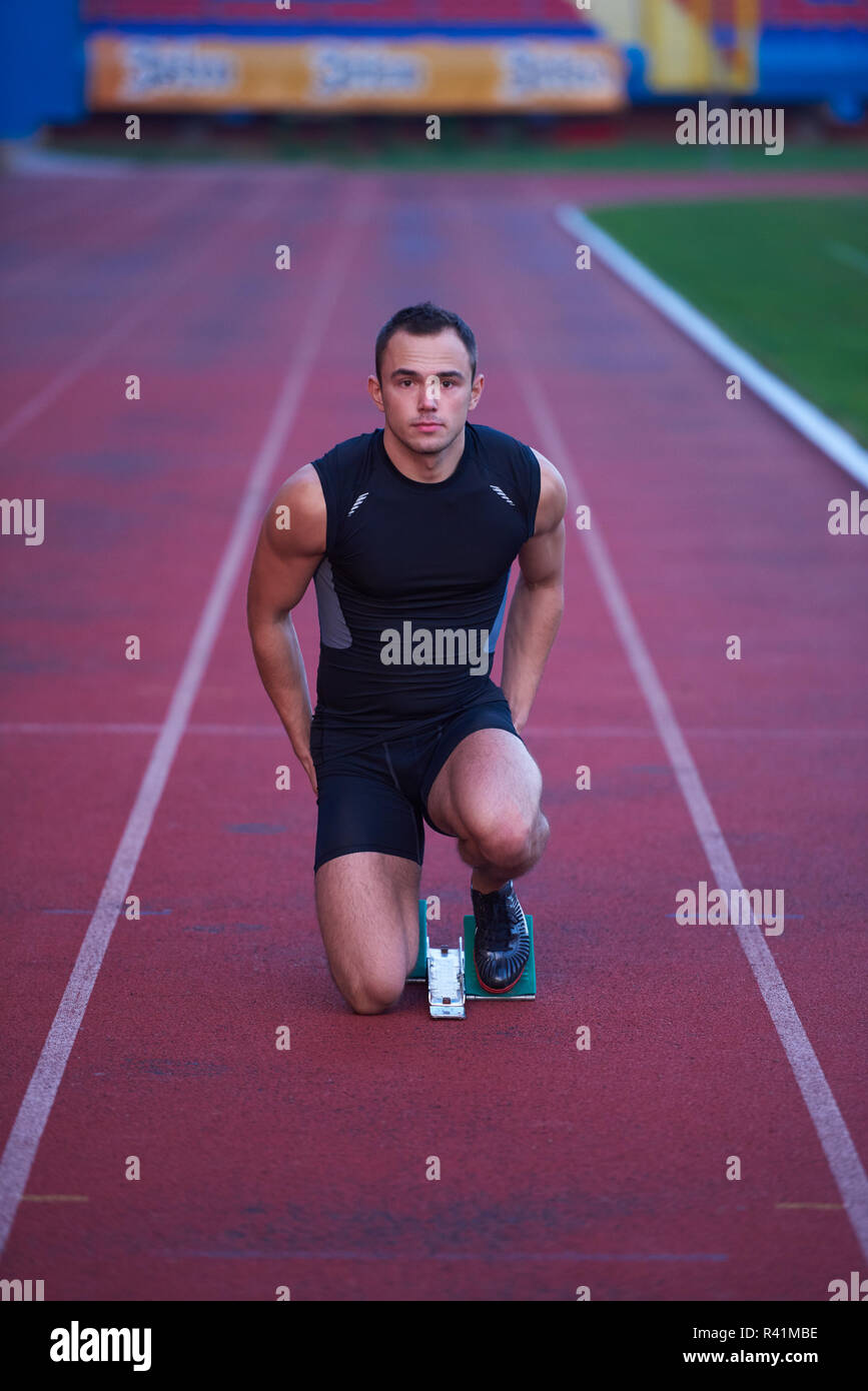 Athletic man start Stock Photo - Alamy