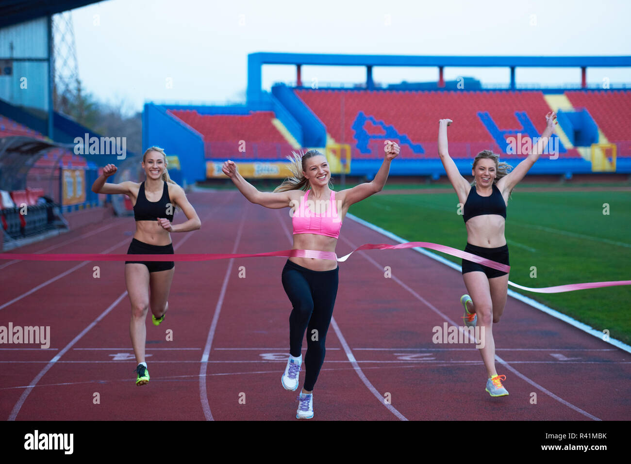 Smiling happy female runners finish female runner hi-res stock ...
