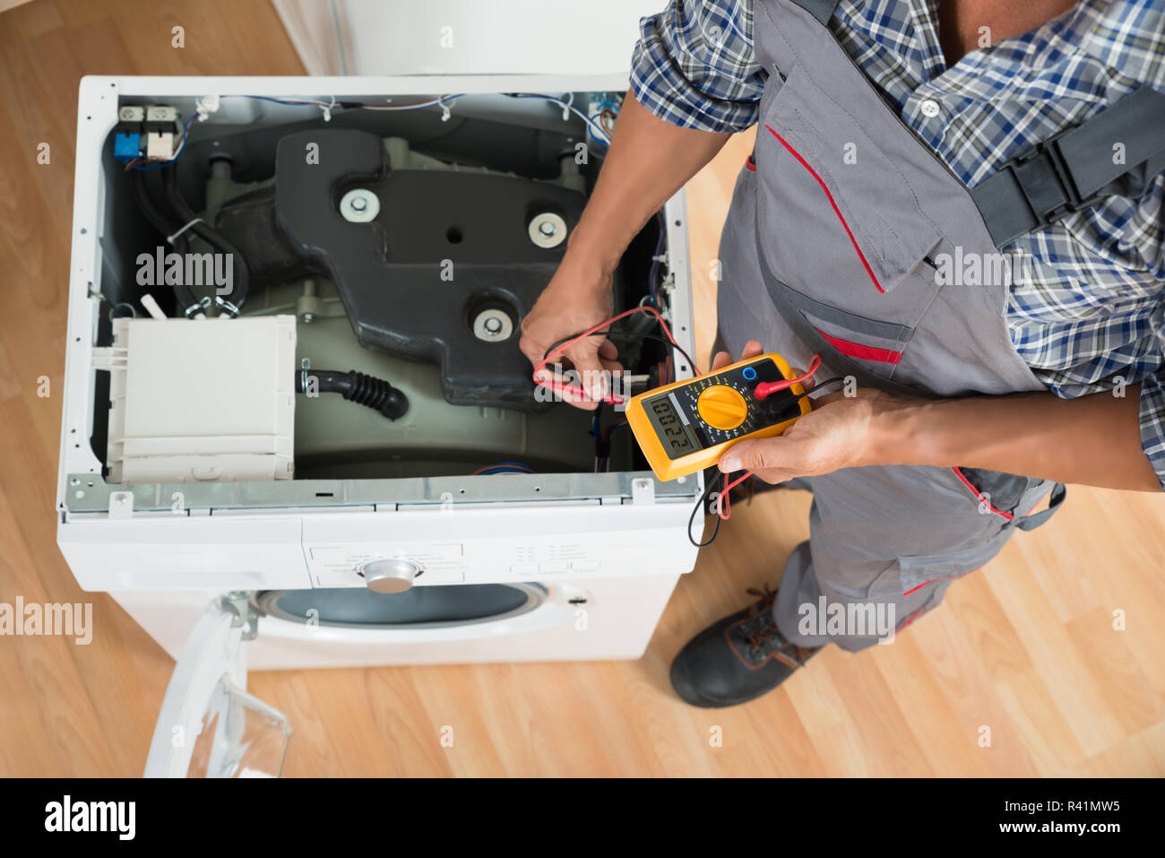 Technician Checking Washing Machine With Digital Multimeter Stock Photo ...