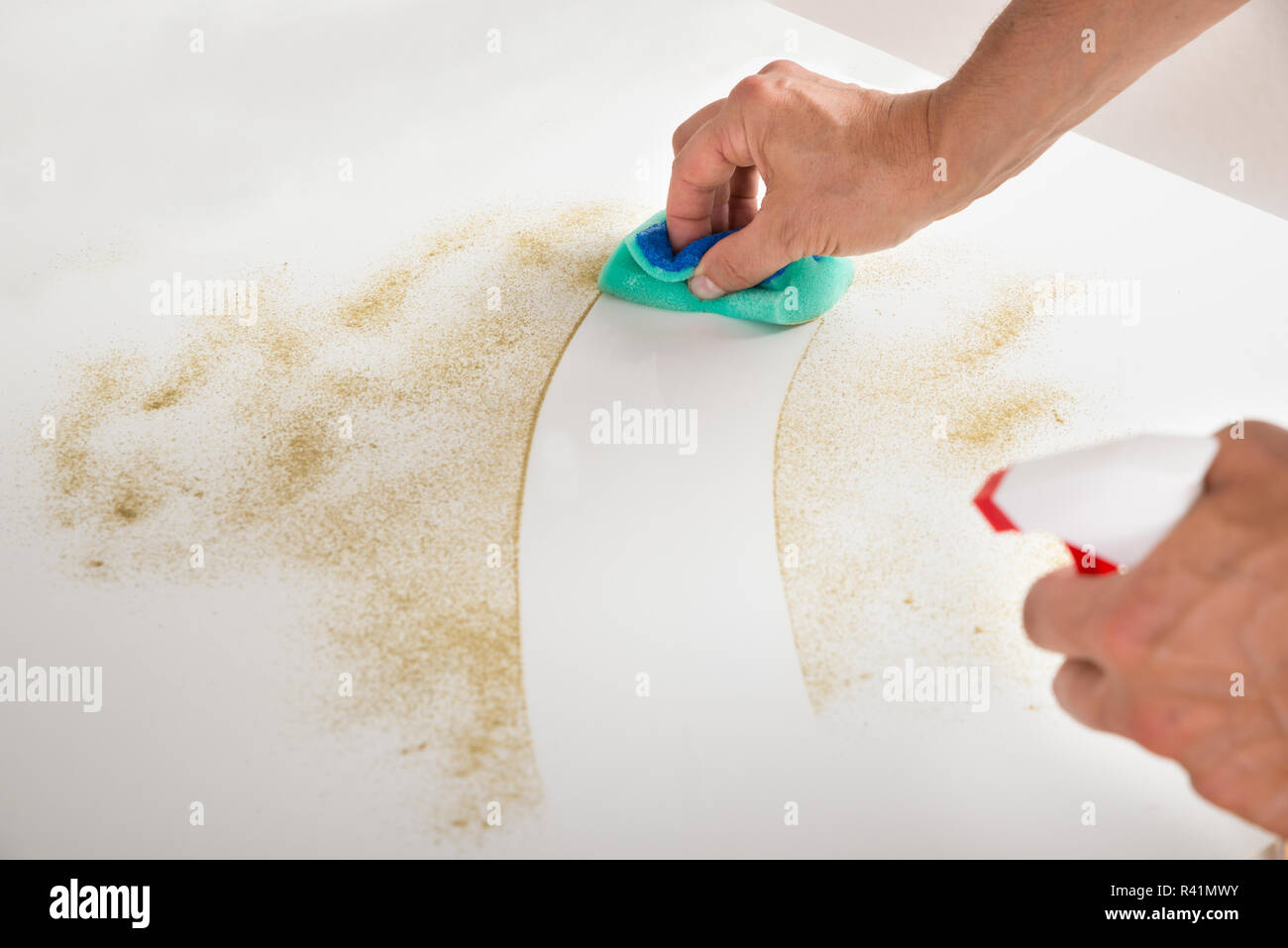Male Janitor Cleaning Counter Stock Photo - Alamy