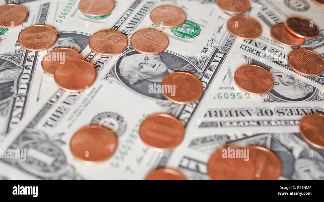 Dollar coins and notes Stock Photo - Alamy