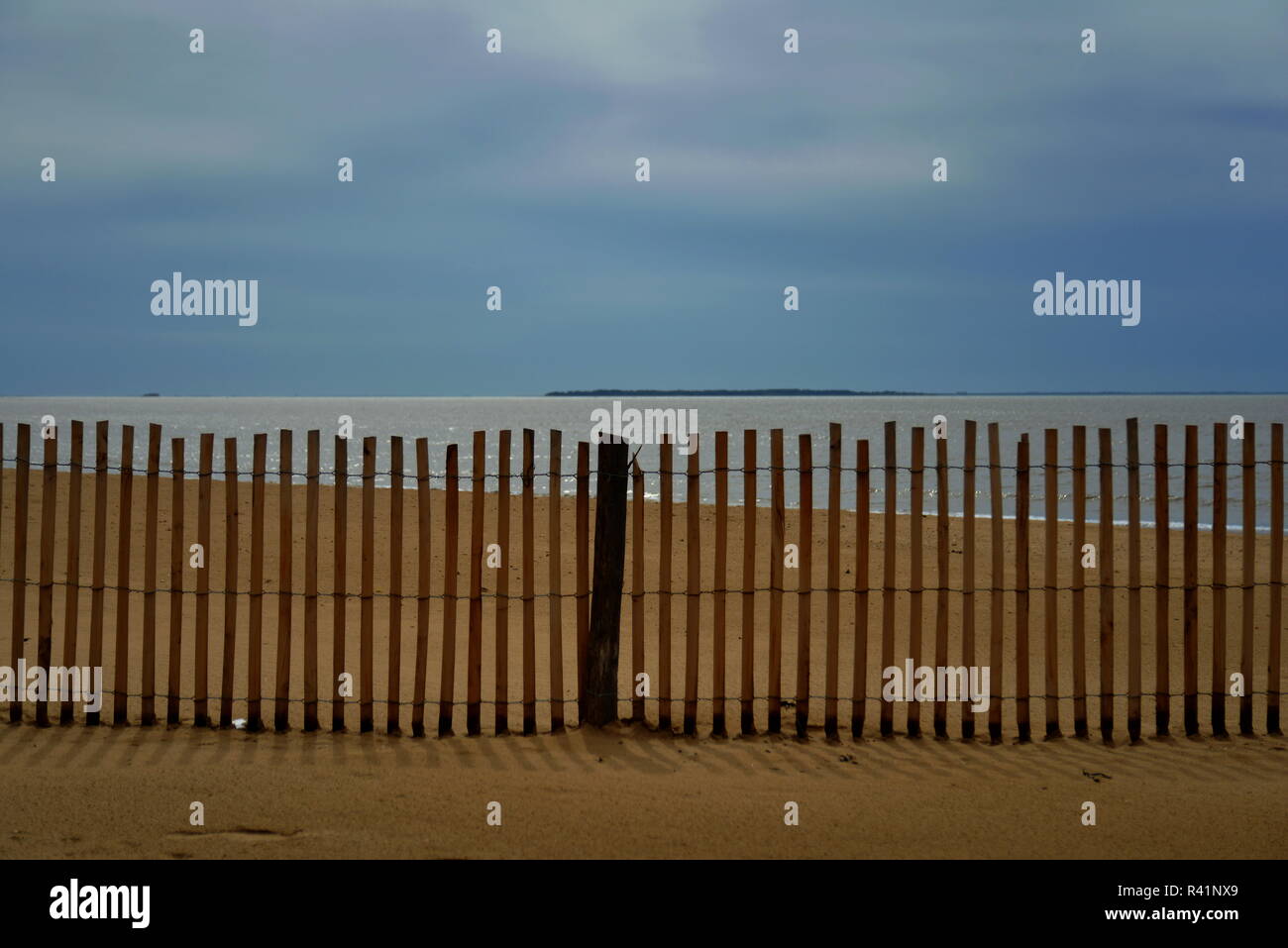 fences on the sandy beach Stock Photo - Alamy