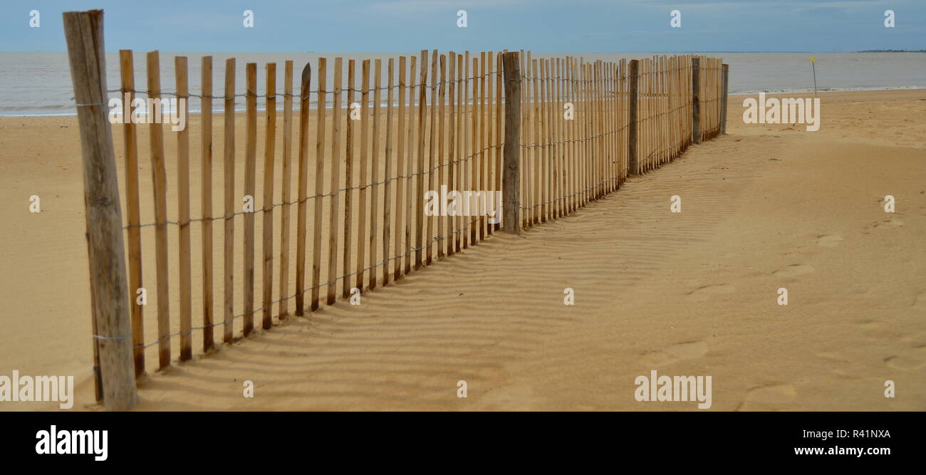 fences on the sandy beach Stock Photo - Alamy