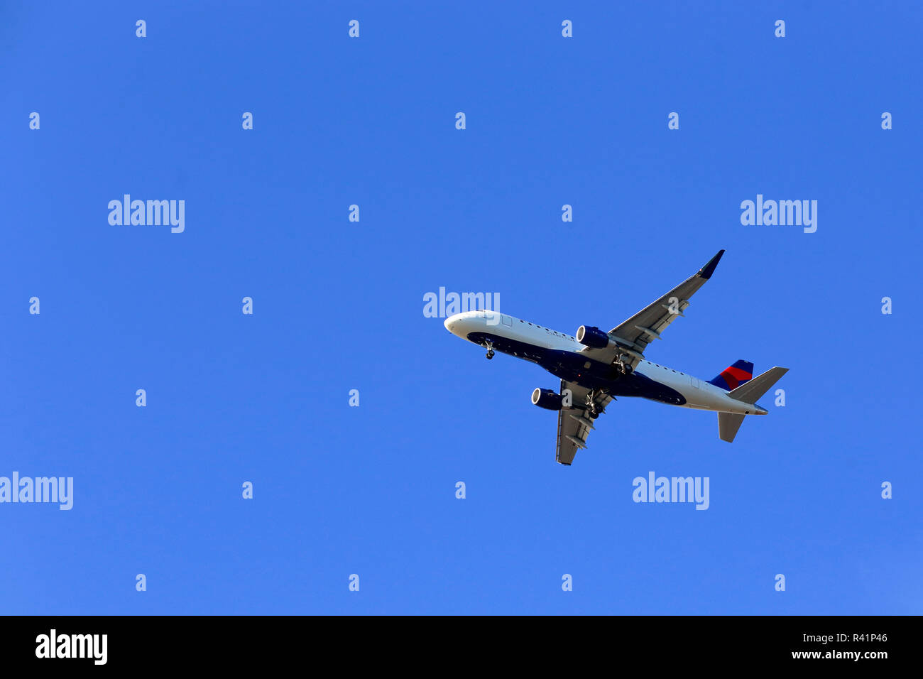 Delta Connection airplane flying overhead Stock Photo - Alamy