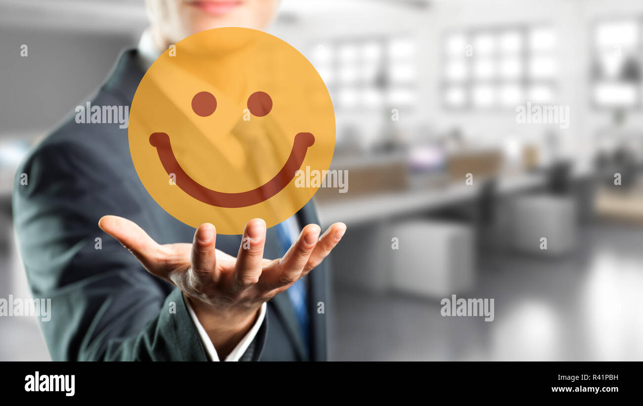 businessman is selecting a happy mood smiley Stock Photo - Alamy