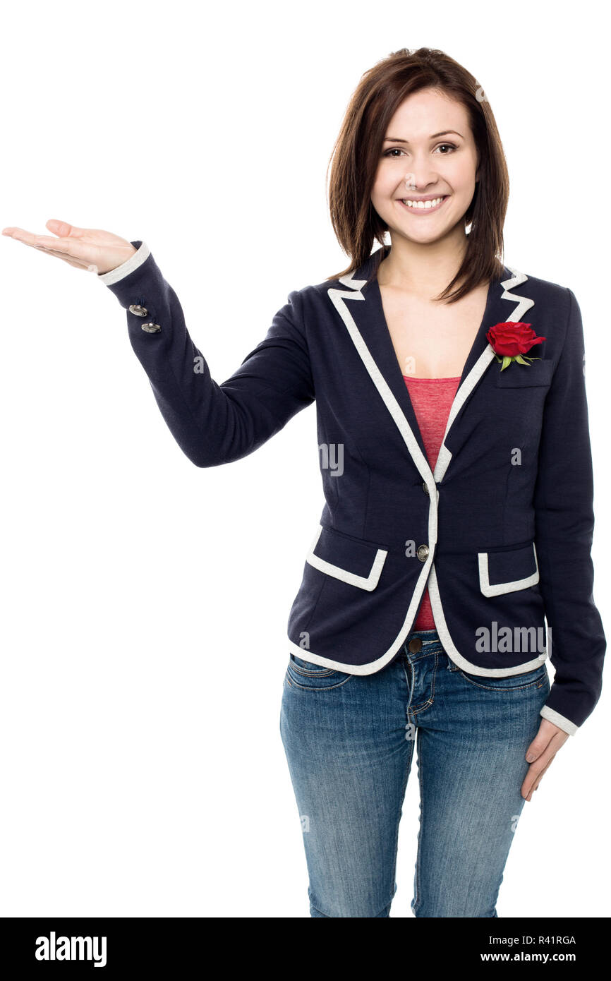 Pretty smiling lady presenting something Stock Photo - Alamy