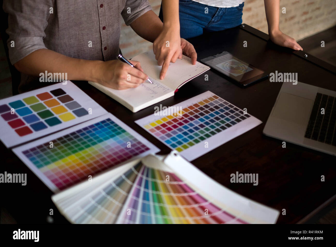 Graphic designers choose colors from the color bands samples for design ...