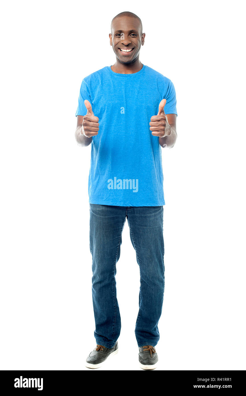 Smiling young man giving best wishes Stock Photo - Alamy