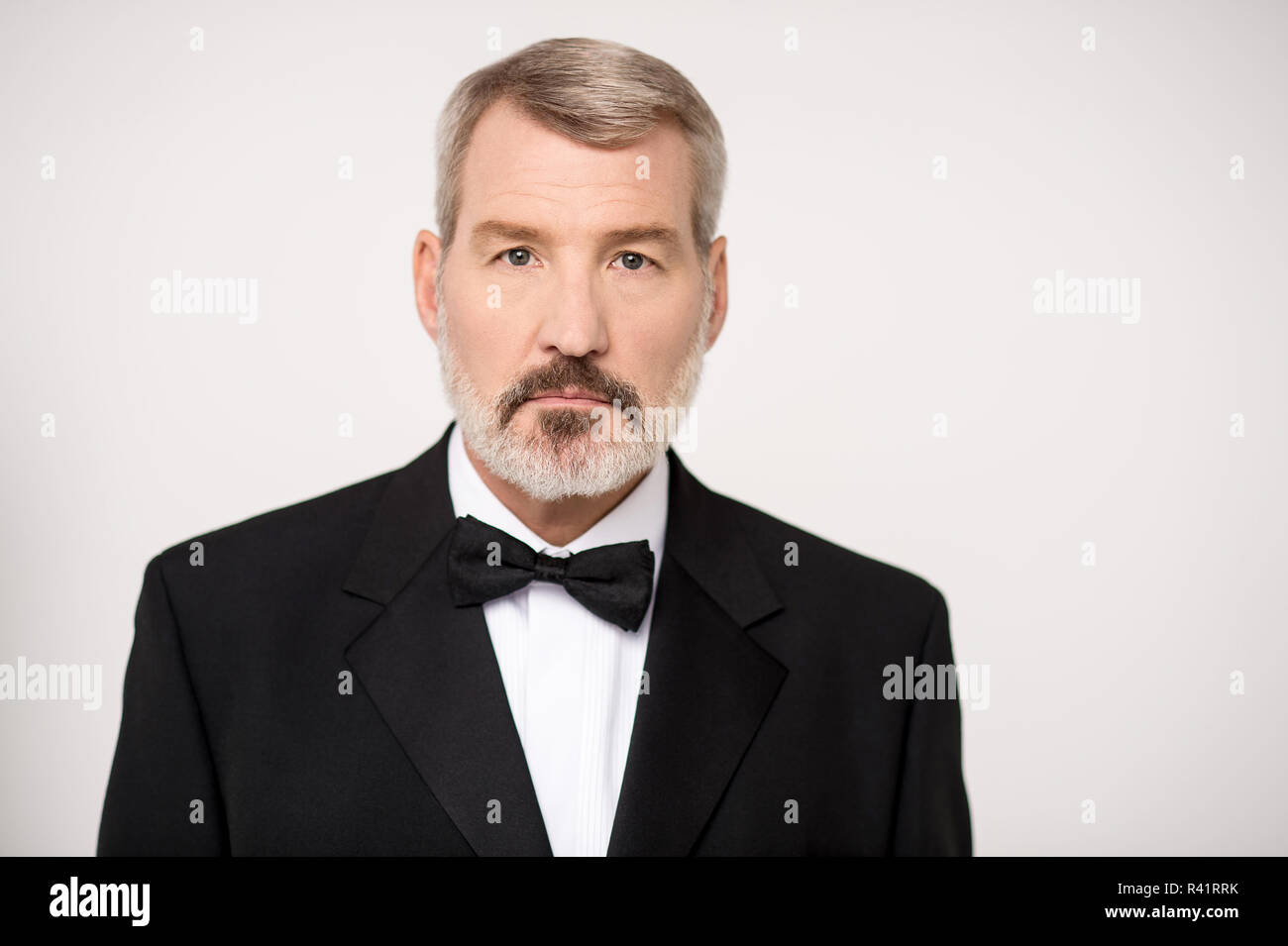 Handsome business tycoon posing Stock Photo - Alamy
