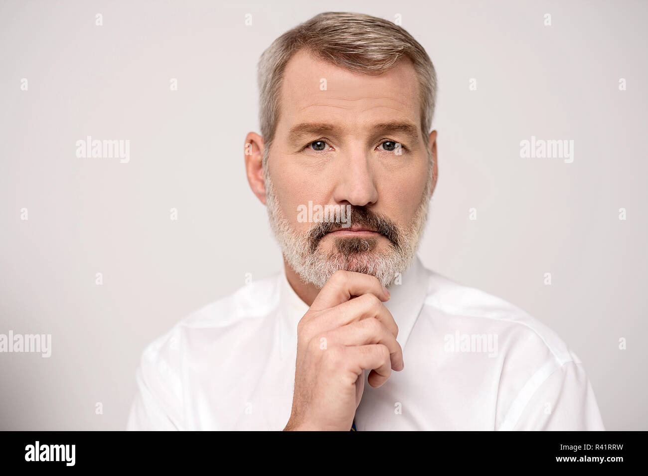 Senior businessman thinking deeply Stock Photo - Alamy