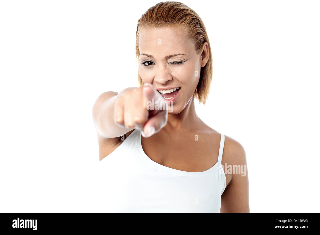 Young woman winking pointing hi-res stock photography and images - Alamy