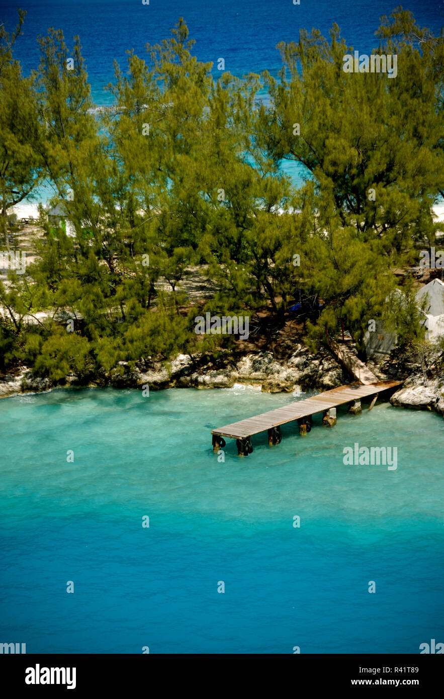 A wooden dock along the Nassau, Bahamas shoreline Stock Photo - Alamy