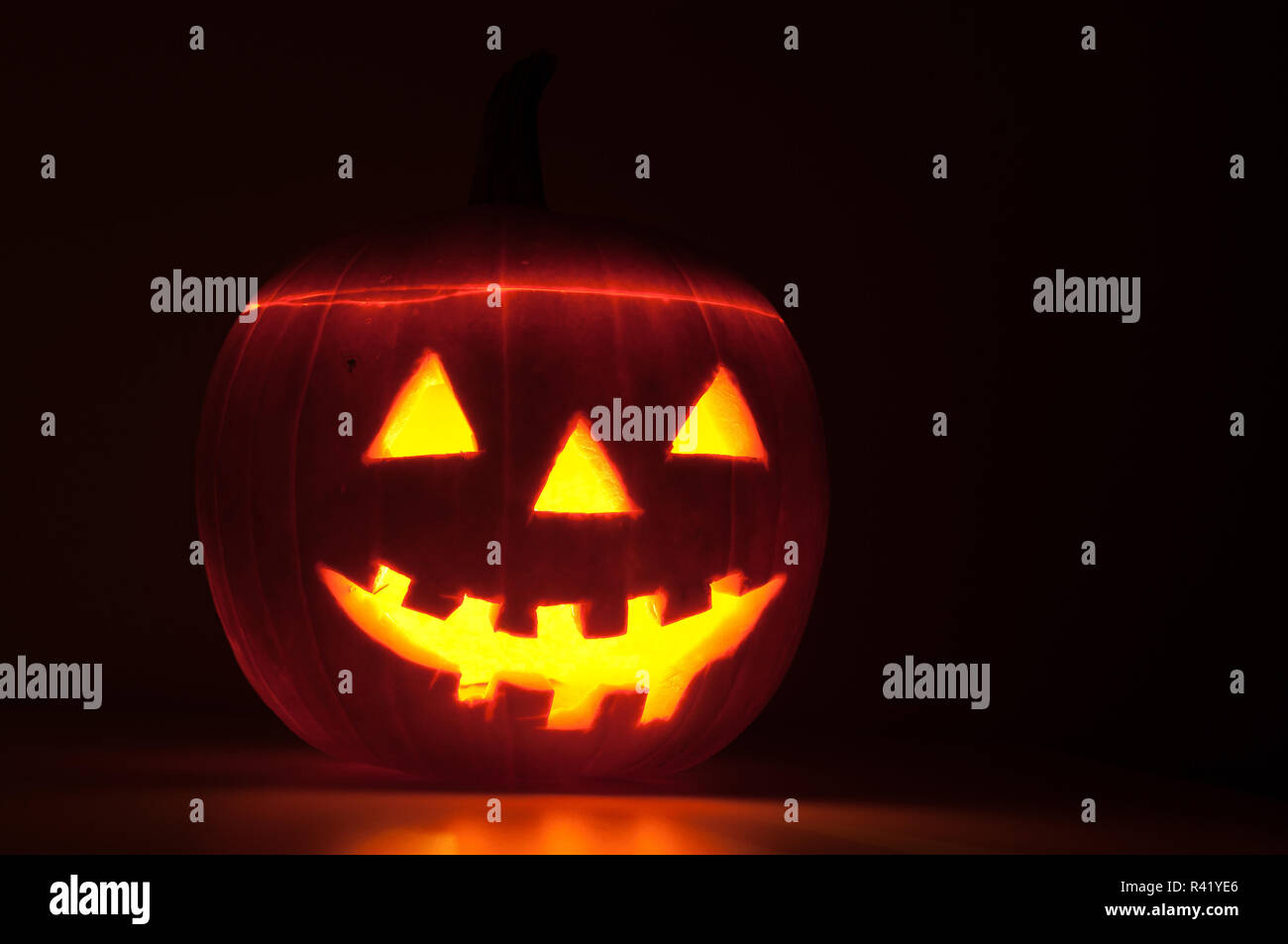 halloween pumpkin glowing in the dark Stock Photo - Alamy
