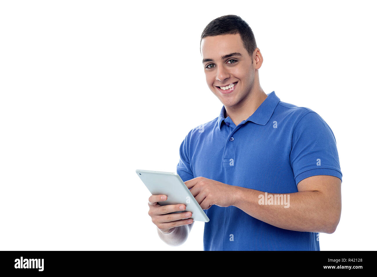 Smart guy browsing on his tablet device Stock Photo - Alamy